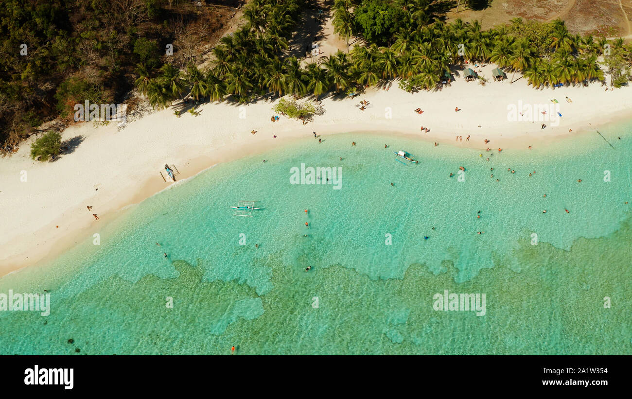 aerial seascape tourists enjoy tropical beach. tropical island with ...