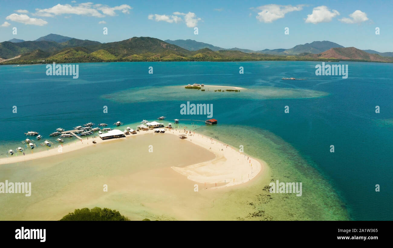 Beautiful beach on tropical island surrounded by coral reef, sandy bar ...