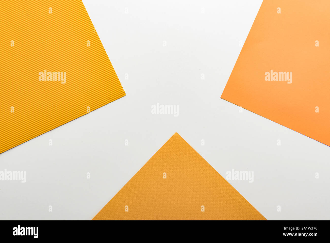 top view of bright yellow paper on white background Stock Photo - Alamy