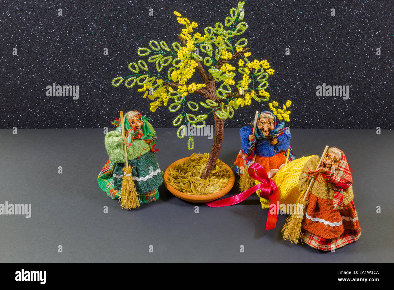 Three old witches with tree in the middle on the black background Stock ...