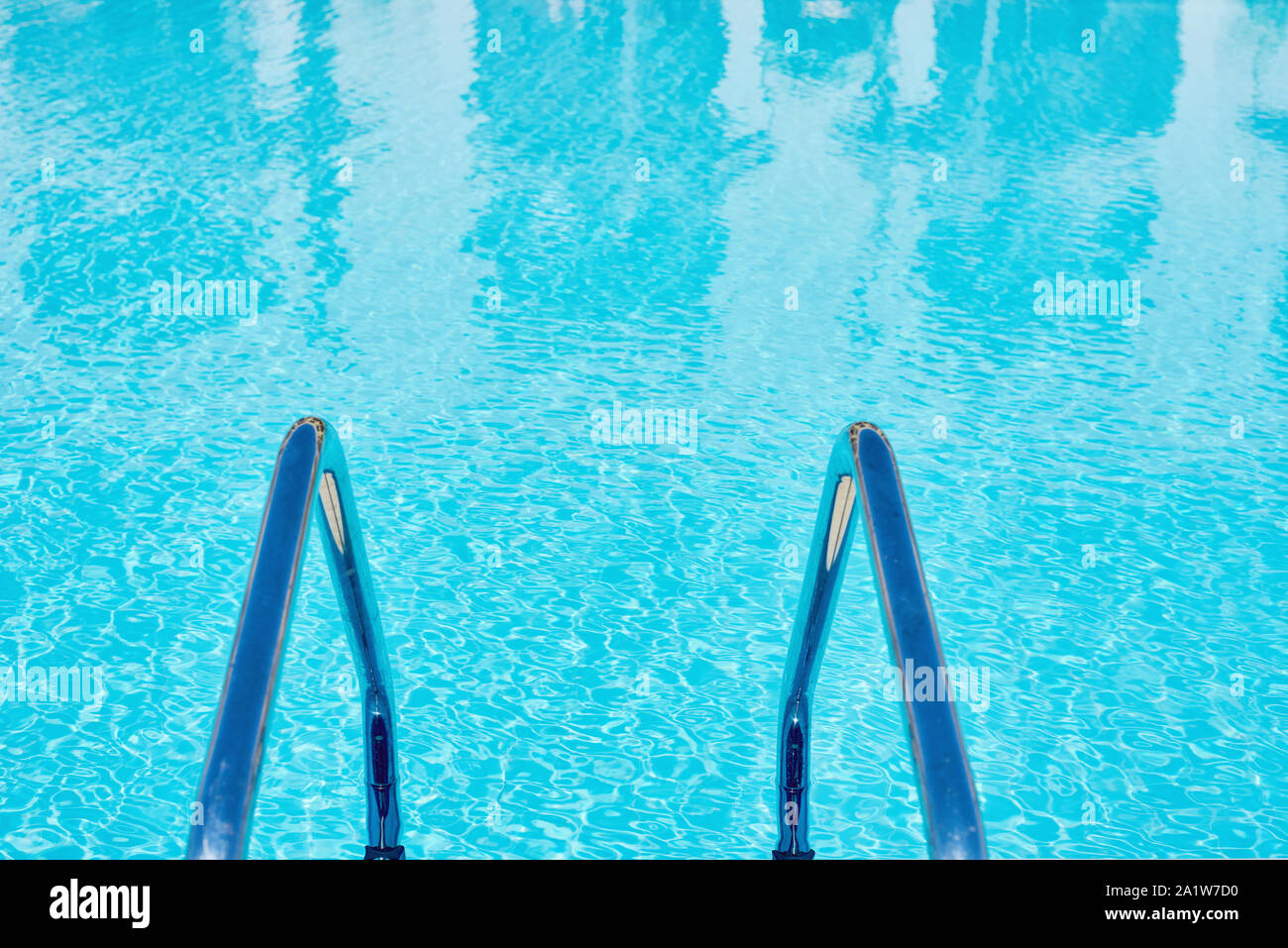 Background of water in blue swimming pool, water surface with sun ...