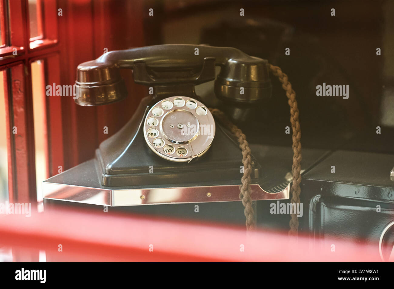 Vintage retro phone in traditional british red booth close up Stock ...
