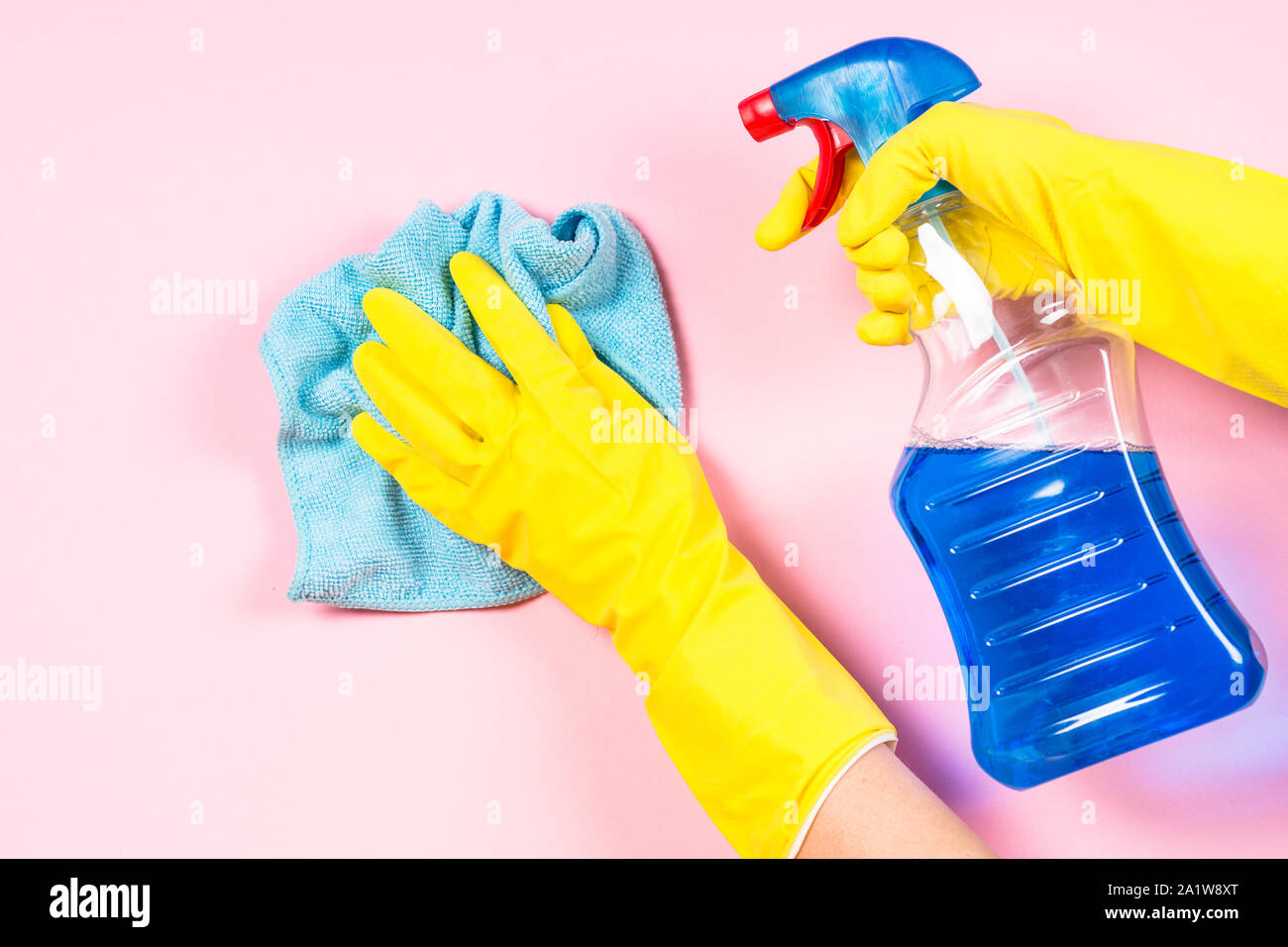 Woman cleaning pink surface Stock Photo - Alamy
