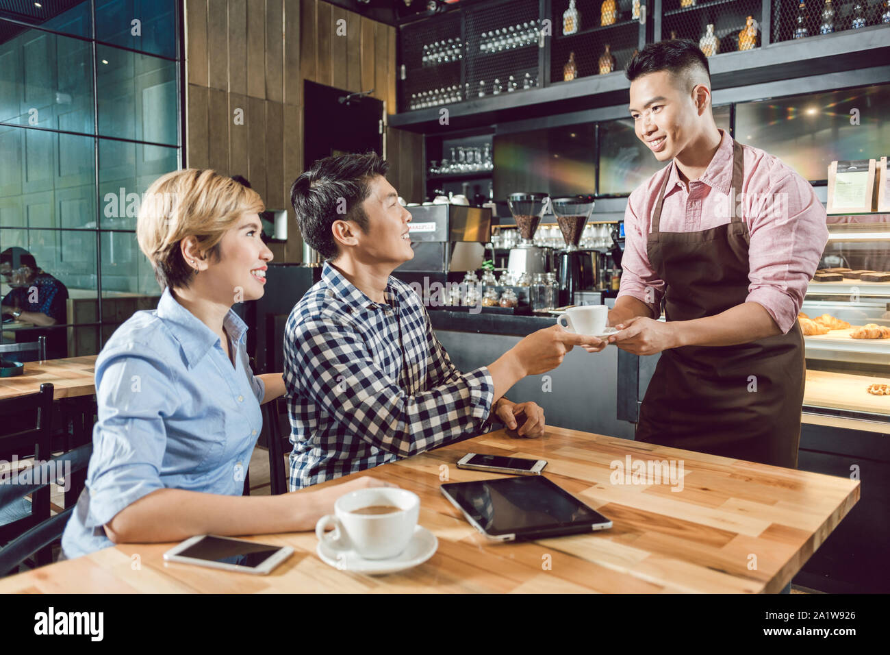 Couple being served in restaurant hi-res stock photography and images ...