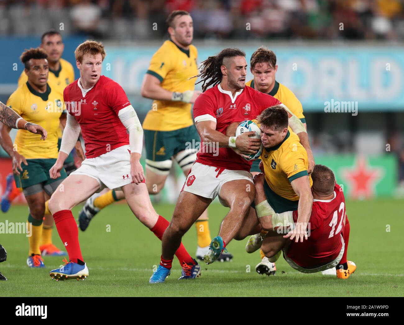 Australia's James O'Connor is tackled by Wales' Josh Navidi and ...