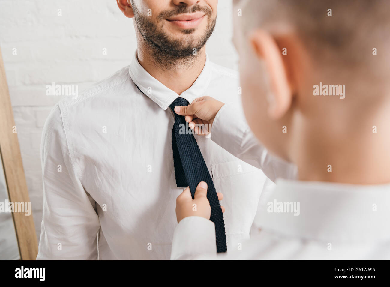 Father helping son tie tie hi-res stock photography and images - Alamy