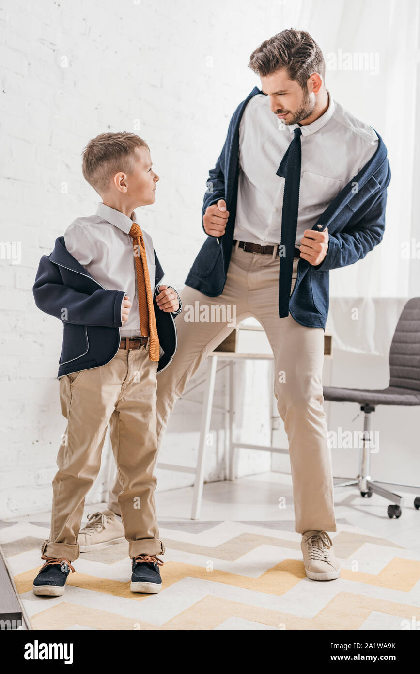 full length view of father and dad in formal wear at home Stock Photo ...
