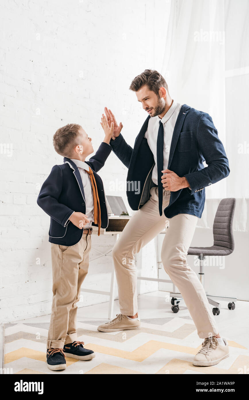 full length view of father and dad in formal wear at home Stock Photo ...