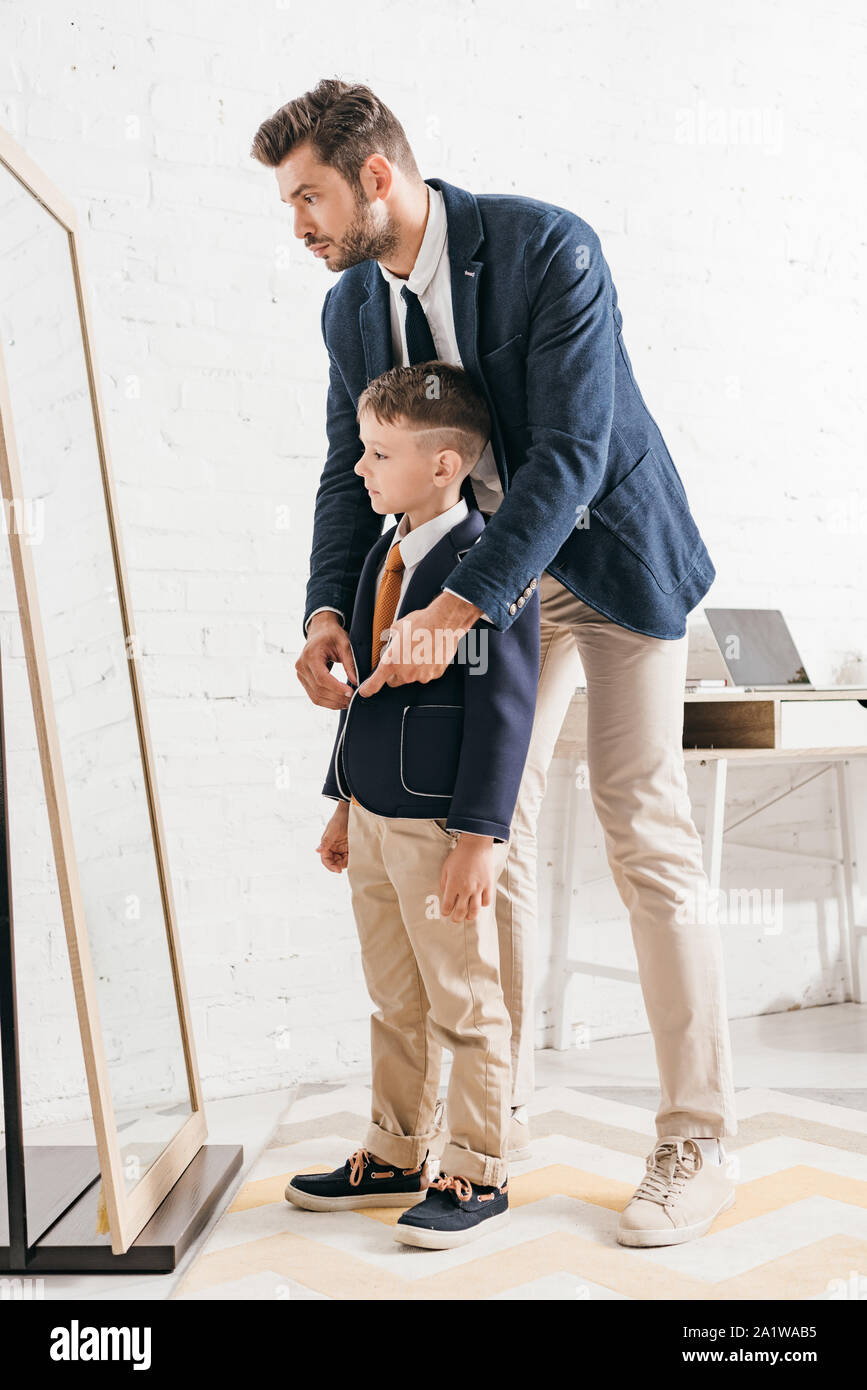 full length view of father and dad in formal wear at home Stock Photo ...