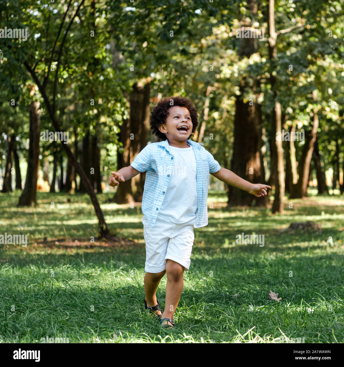 African american boy running hi-res stock photography and images - Alamy