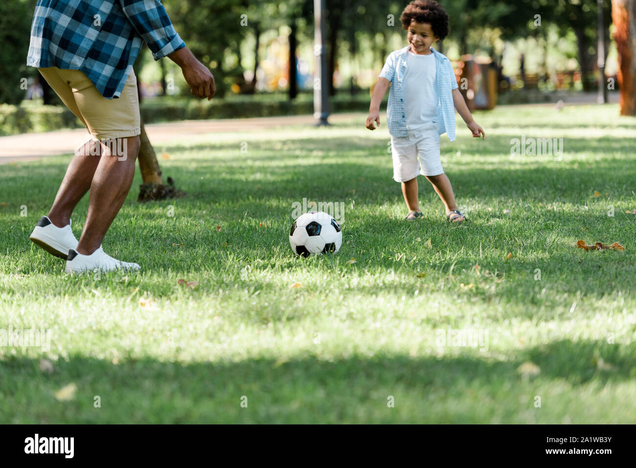 Black father son playing football hi-res stock photography and images ...