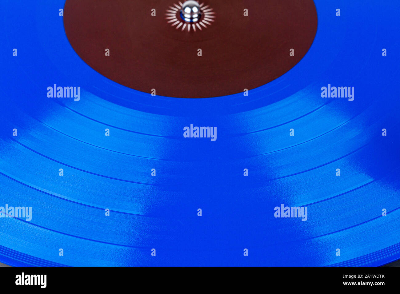 Close up of blue vinyl surface with brown label. Blue vinyl record ...