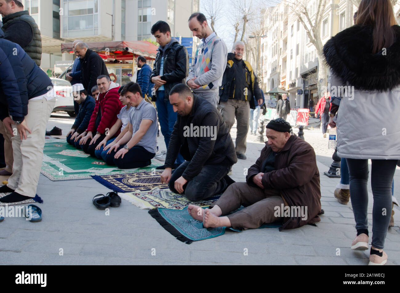 Muslim men pray in street hi-res stock photography and images - Alamy
