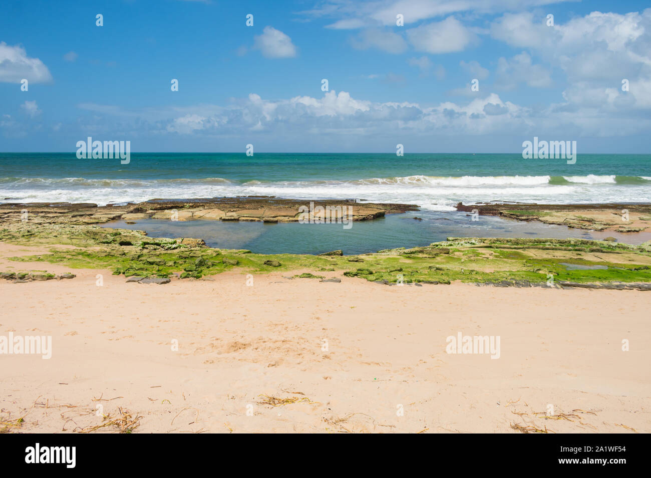 Natural swimming pool at the beach near the Hippie village in Arembepe ...
