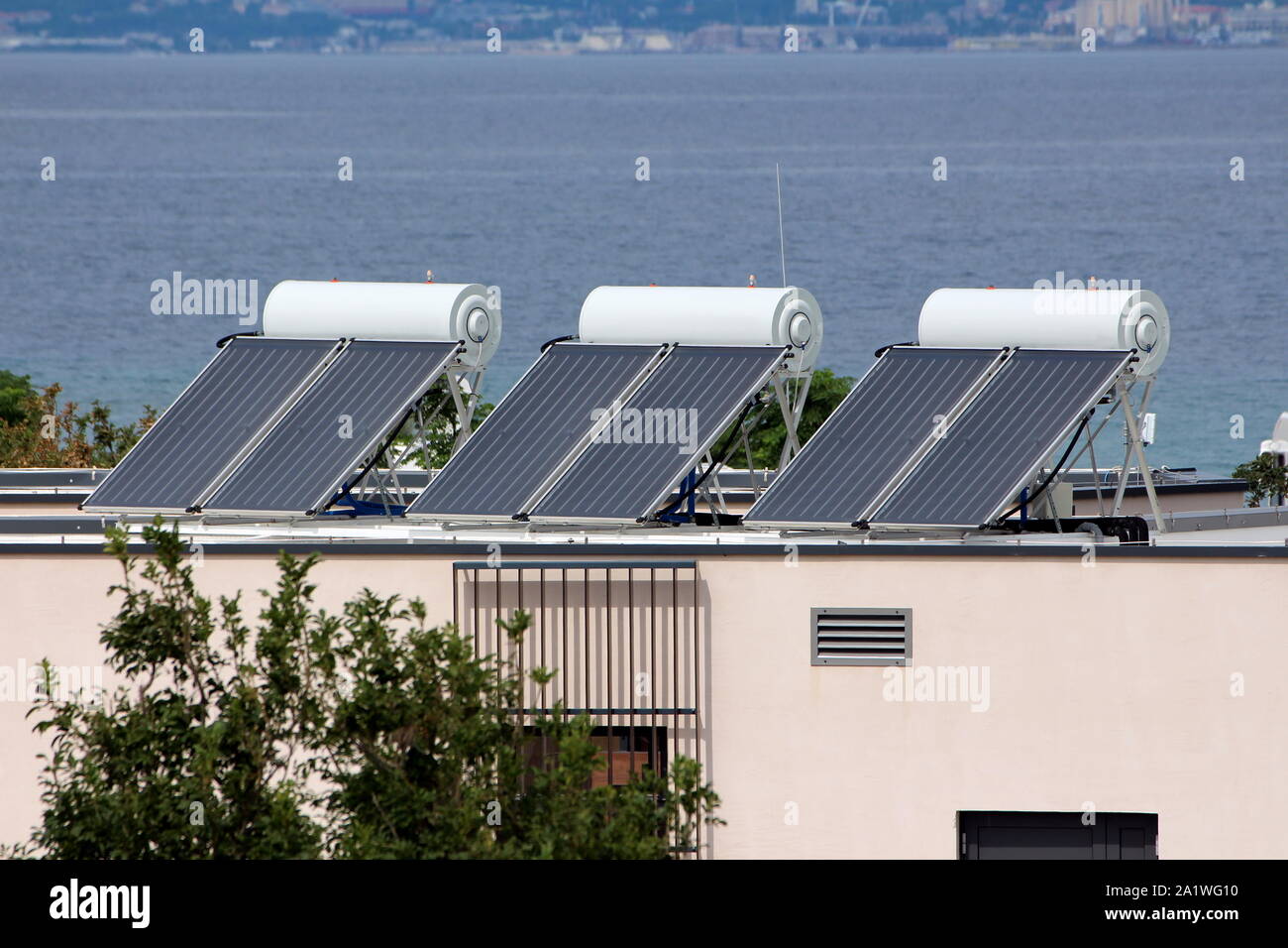 Three brand new solar panels for heating water installed on roof of ...
