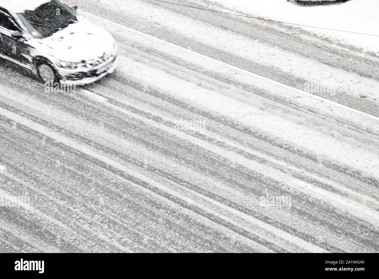 Blurry driving car on the empty city street during a snowfall Stock ...