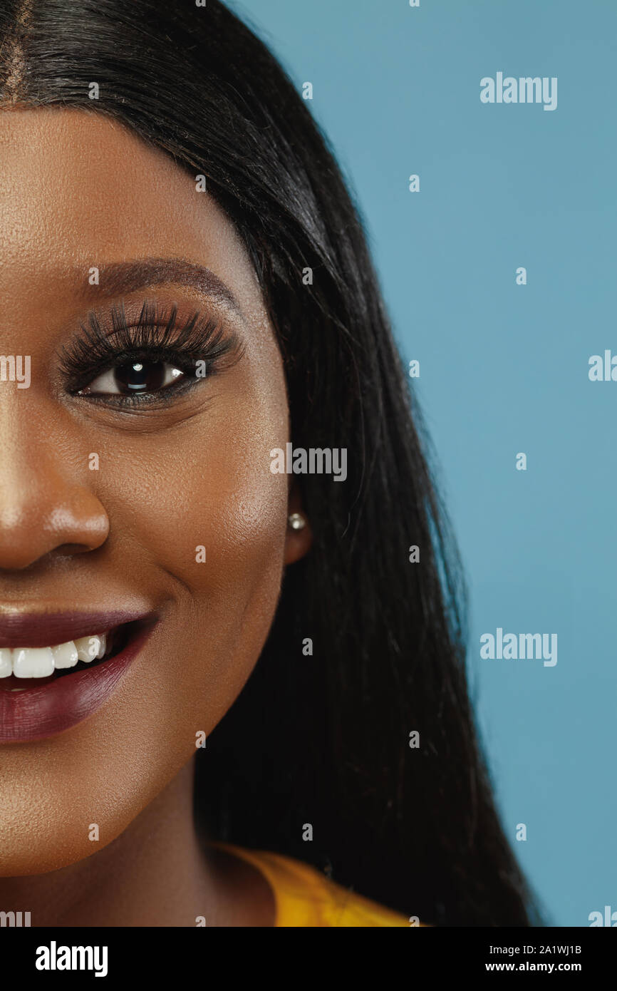 African-american young woman's close up portrait on studio background ...