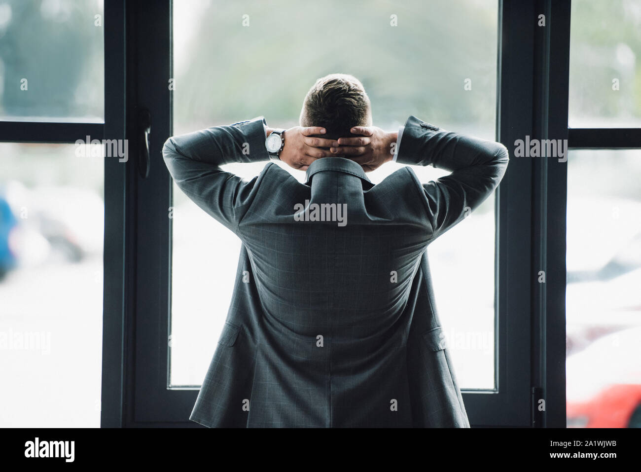 back view of man in formal wear with crossed arms Stock Photo - Alamy