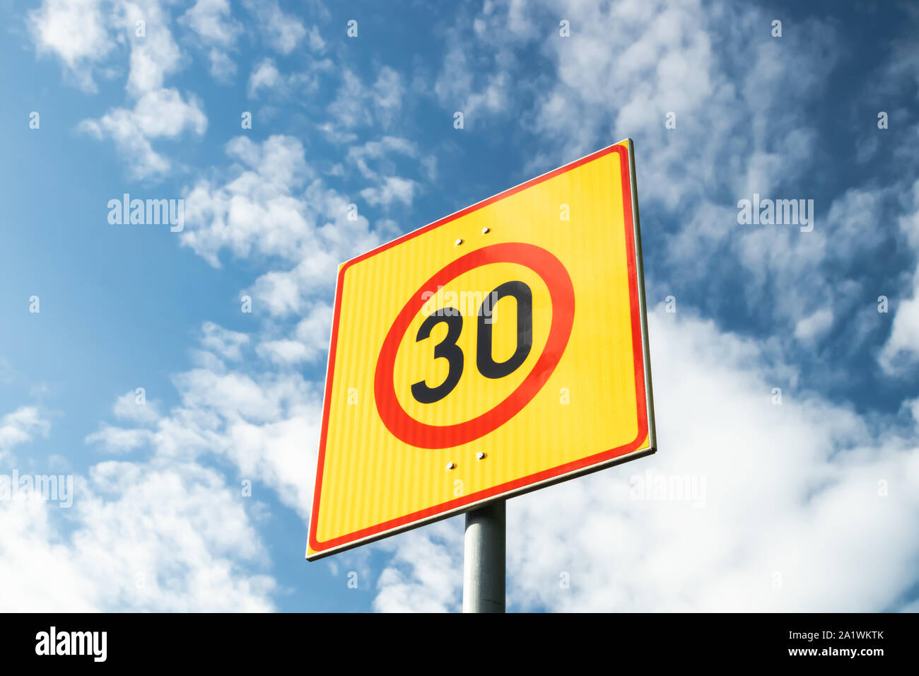 Finnish speed limit sign 30 km h on blue sky background Stock Photo - Alamy