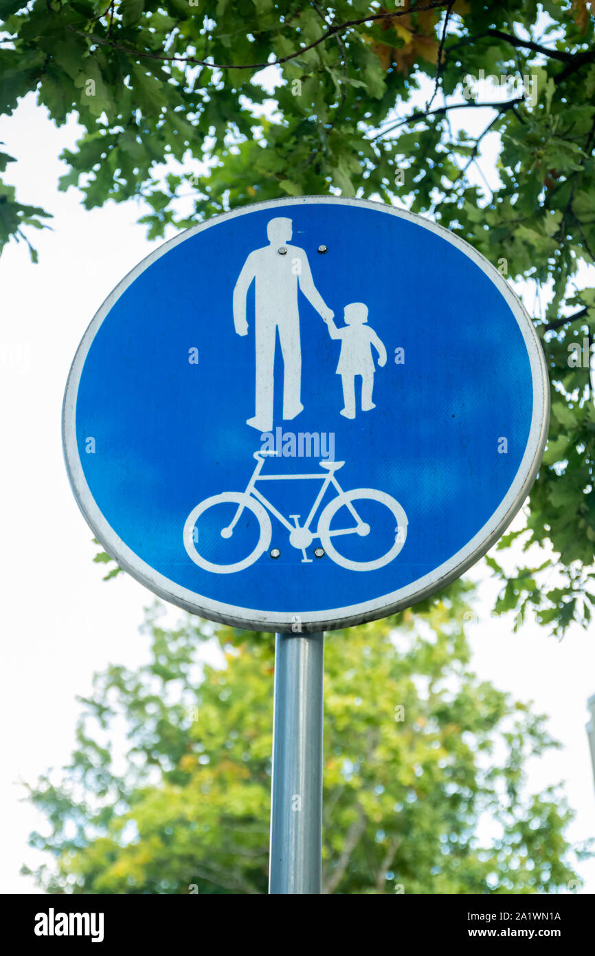 Road sign for bikes and pedestrians. Blue round traffic sign for safety ...