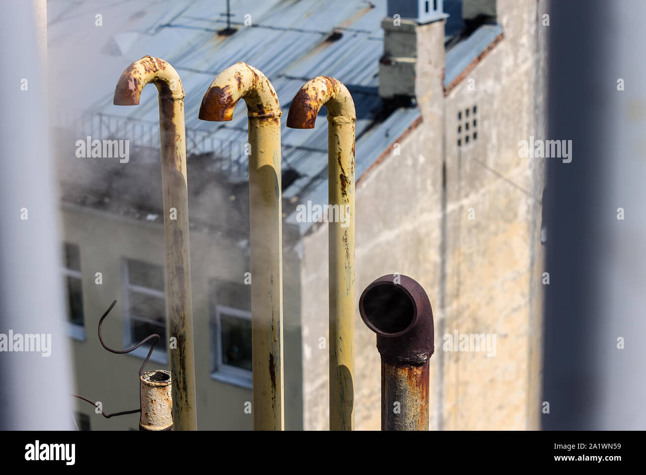 Heat pipes from which hot steam comes out on the roof of the building ...
