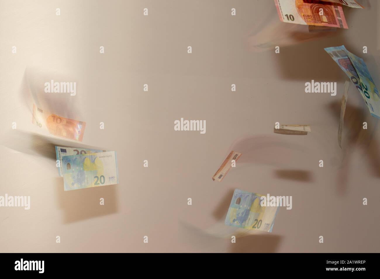 flying euro banknotes, white background Stock Photo - Alamy