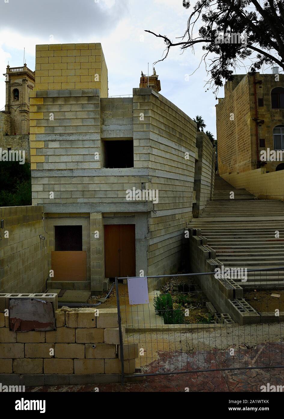 Modern building under construction in a small space Stock Photo - Alamy