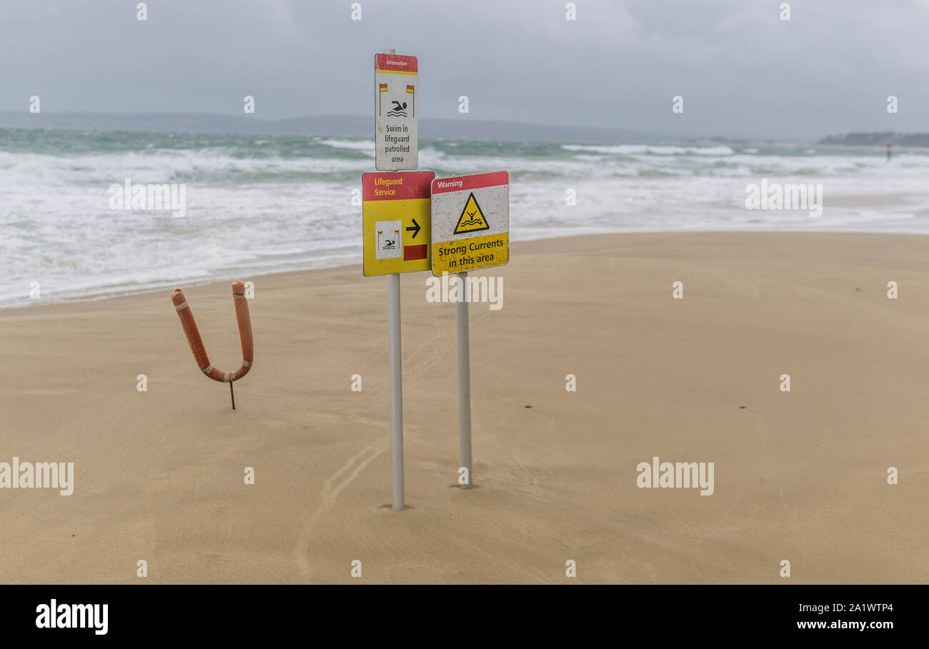 Warning signs at the Bournemouth seafront, Dorset, UK. display for ...