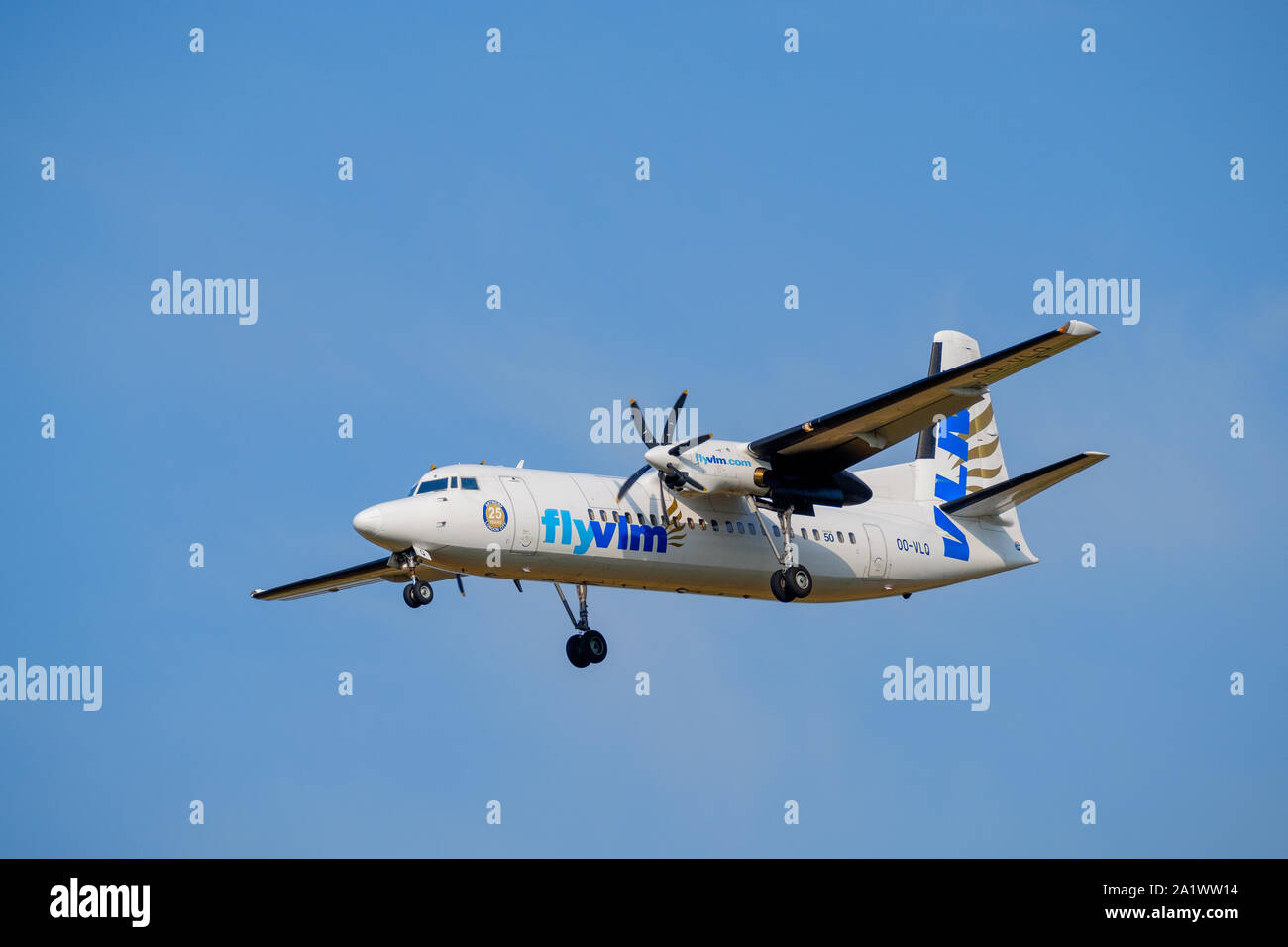 VLM Airlines Company airplane flying in blue sky Stock Photo - Alamy