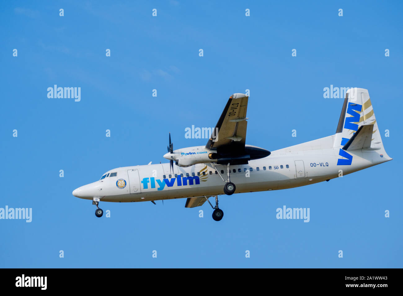 VLM Airlines Company airplane flying in blue sky Stock Photo - Alamy