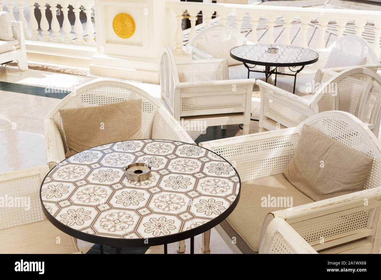 Round marble stone tables in the outdoor restaurant Stock Photo - Alamy