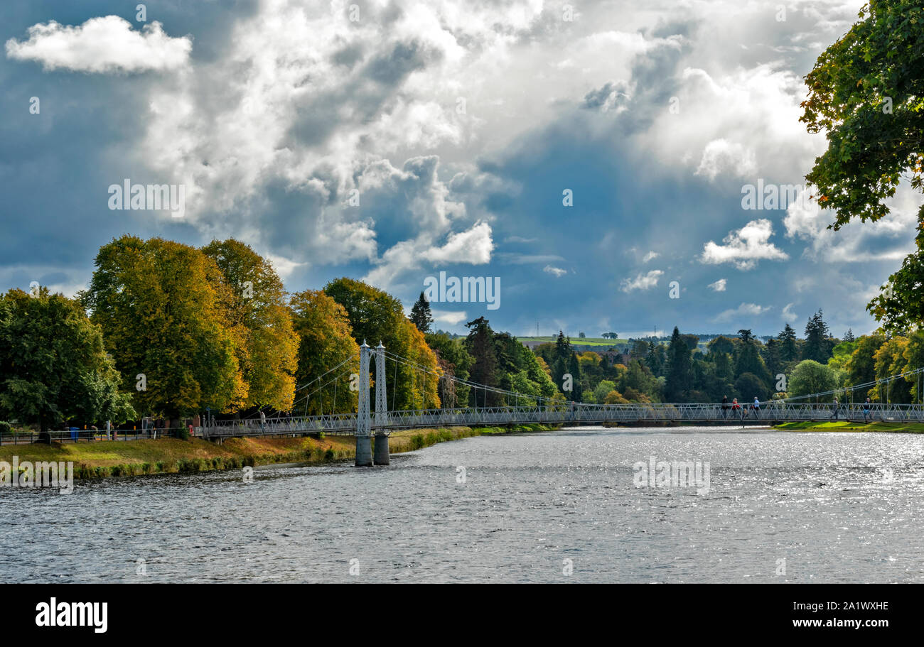 INVERNESS CITY SCOTLAND PEOPLE CROSSING THE INFIRMARY SUSPENSION BRIDGE ...