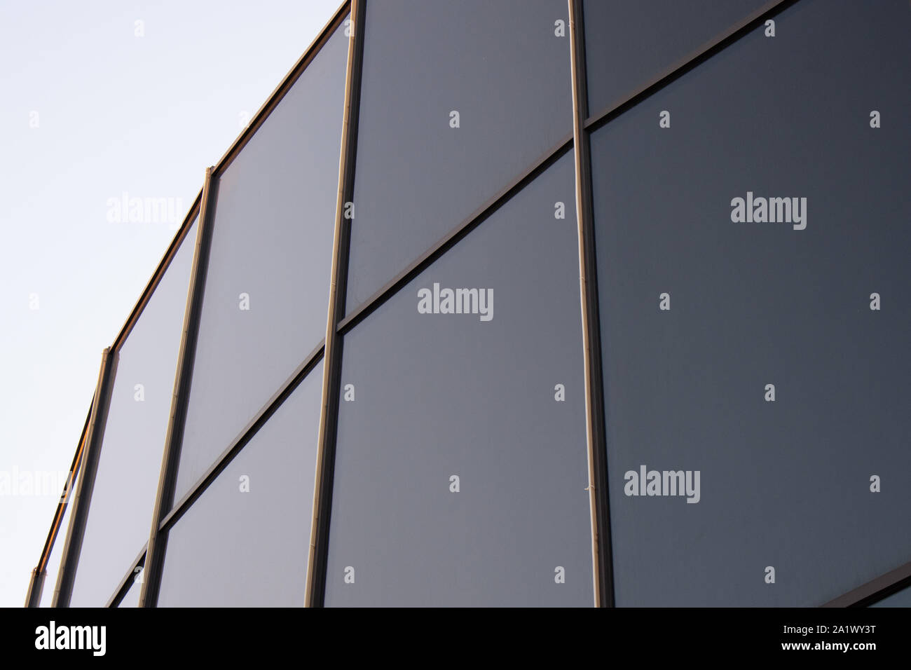 Glass architecture. Double-exposure tilt photo of contemporary office ...