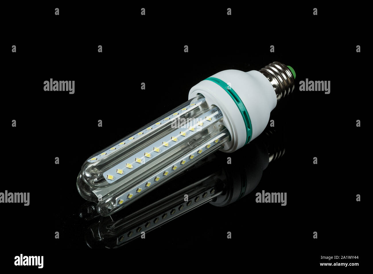 led energy saving lamps on black isolated background. on the glass ...