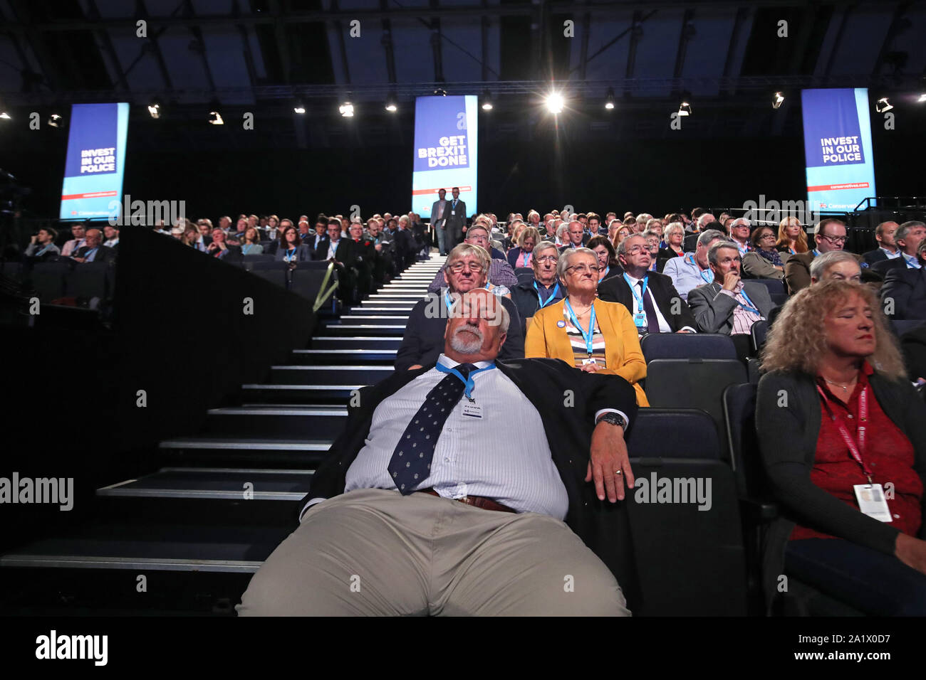 People in the main hall listen to speakers at the Conservative Party ...