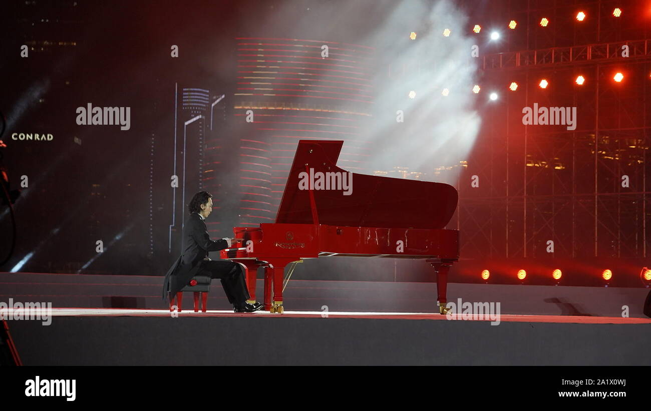 Guangzhou, China. 28th Sep, 2019. Pianist Wu Muye performs "Defend the ...