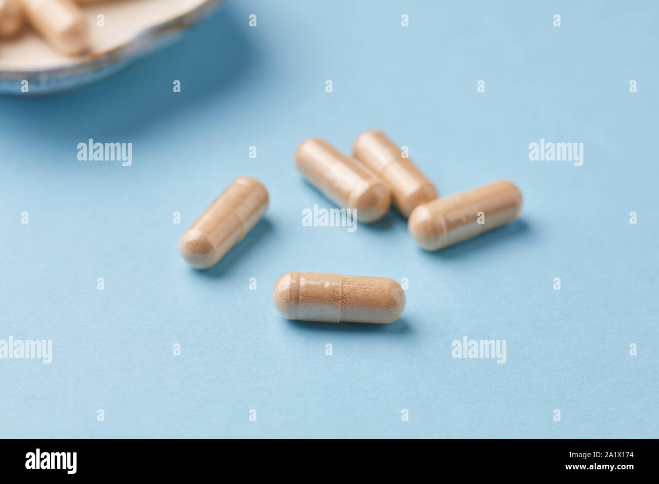 Ashwagandha (Withania somnifera) capsules. Bright paper background ...