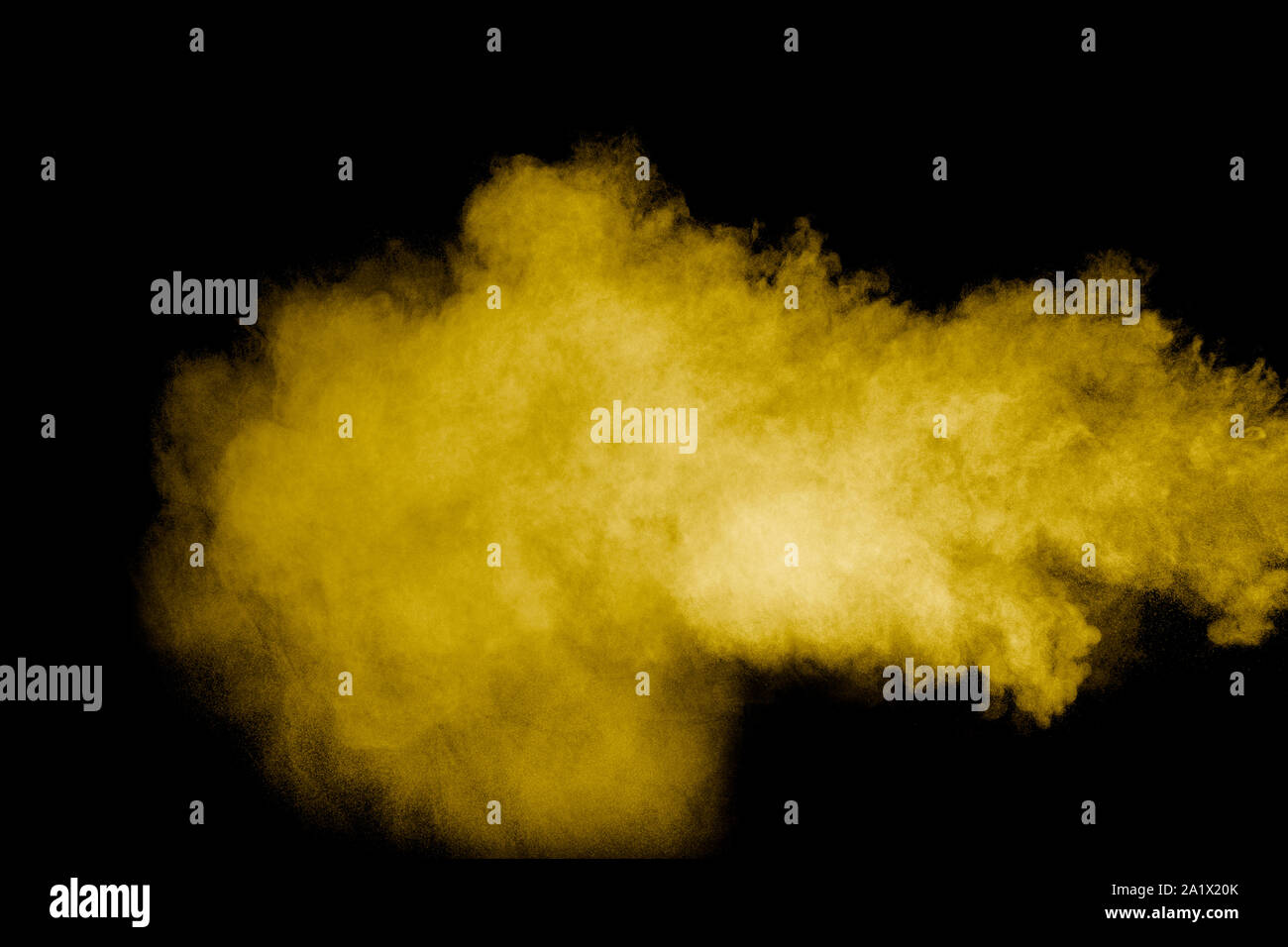 Yellow dust particles explosion on black background.Yellow powder ...