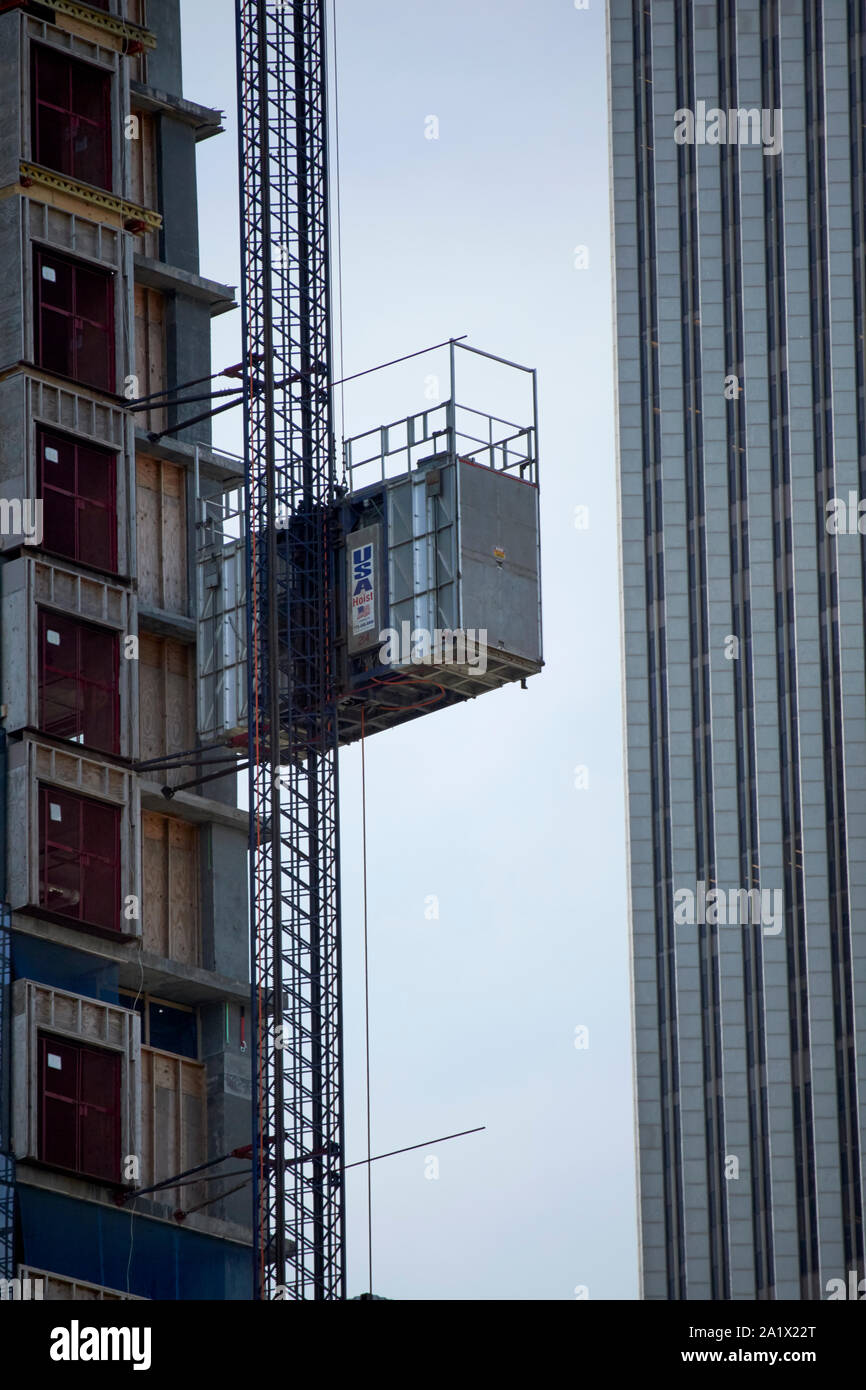 external building construction lift on tower under construction at ...