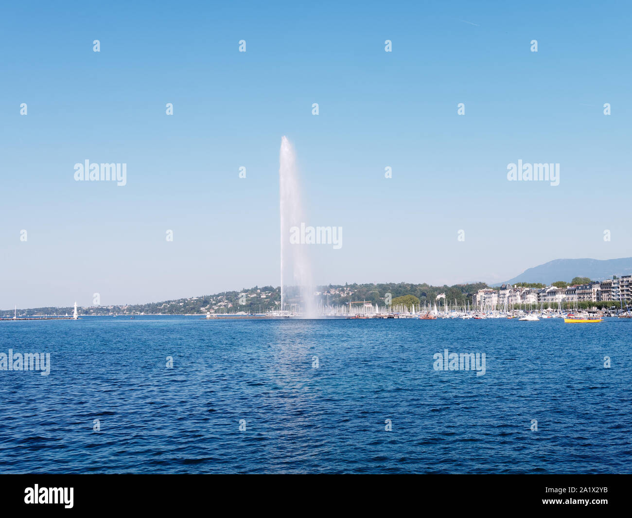 Boats on lake geneva switzerland with jet deau fountain geneva hi-res ...