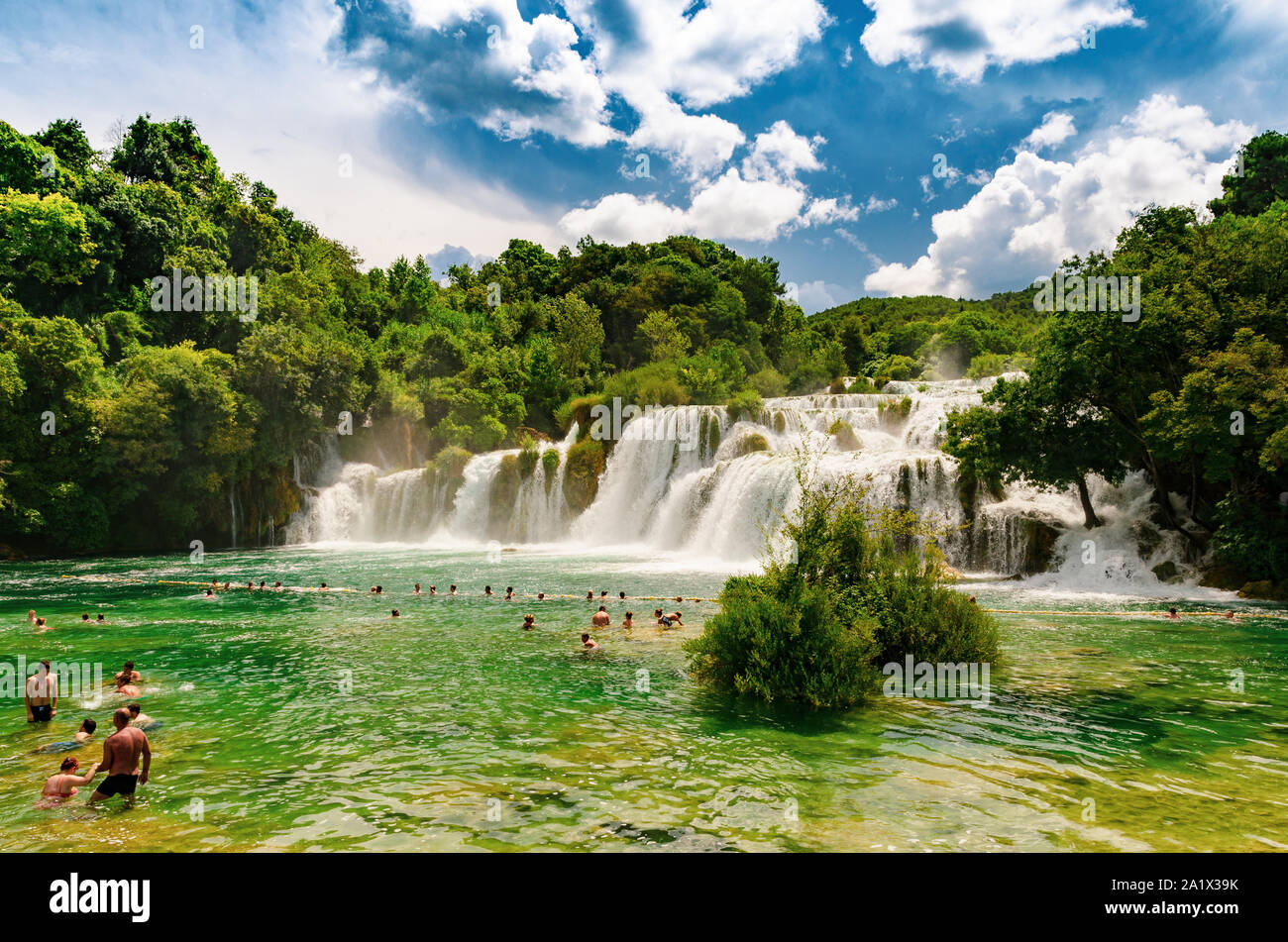 Waterfalls of Croatia.Tourists swimming near waterfalls in crystal ...