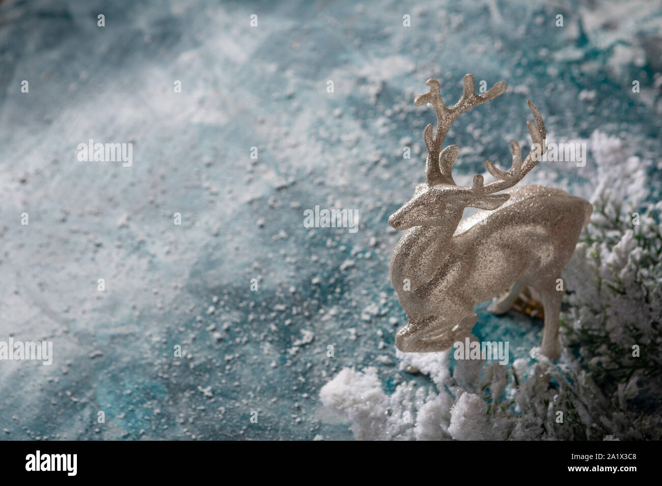 Silver deer on winter blue background, holidays Stock Photo - Alamy