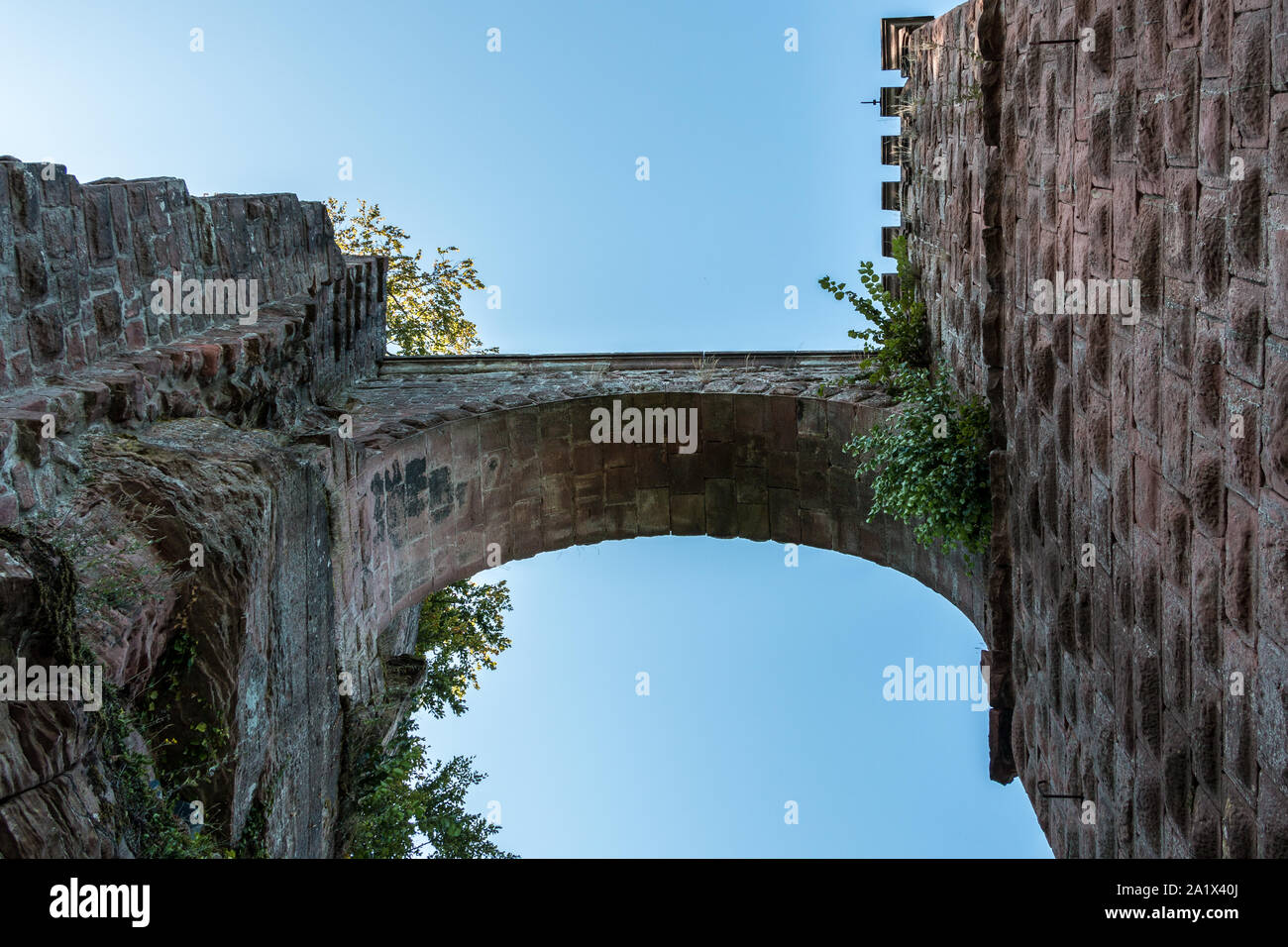 A bridge between castle and tower made of red sandstone Stock Photo - Alamy