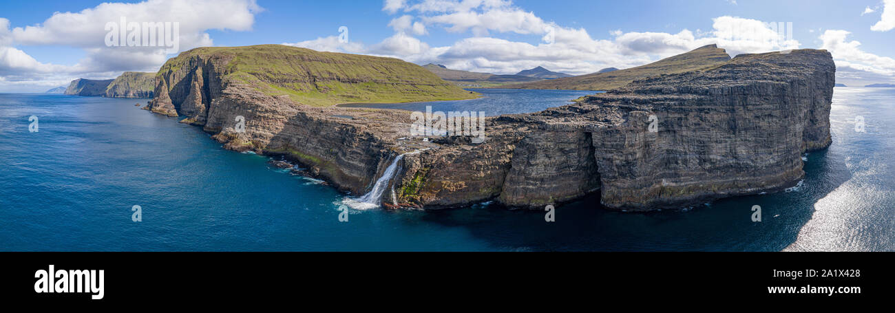 Leitisvatn lake and Bosdalafossur waterfall on Vagar island coastline ...