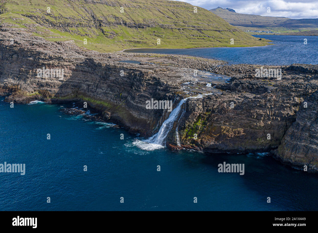 Leitisvatn lake and Bosdalafossur waterfall on Vagar island coastline ...