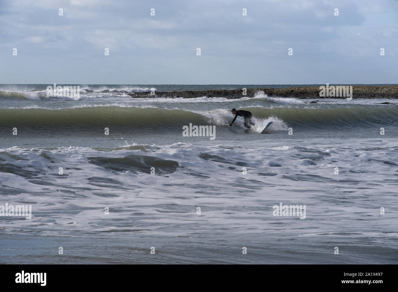 Winter surfing at Broad Beach on Anglesey Stock Photo - Alamy