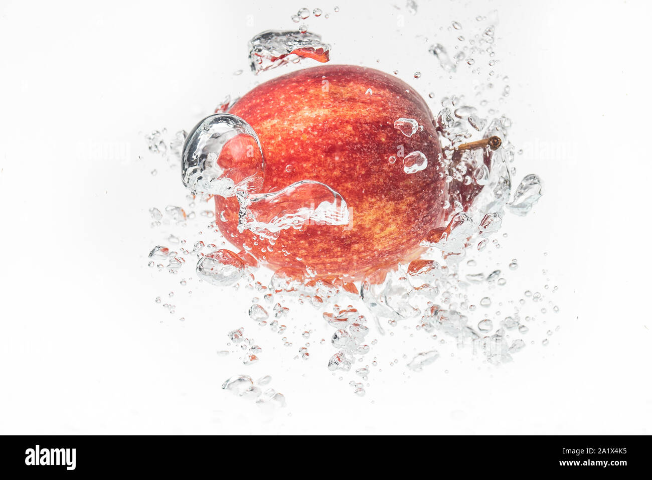 Apple falls under water with a splash. With lots of air bubbles Stock ...