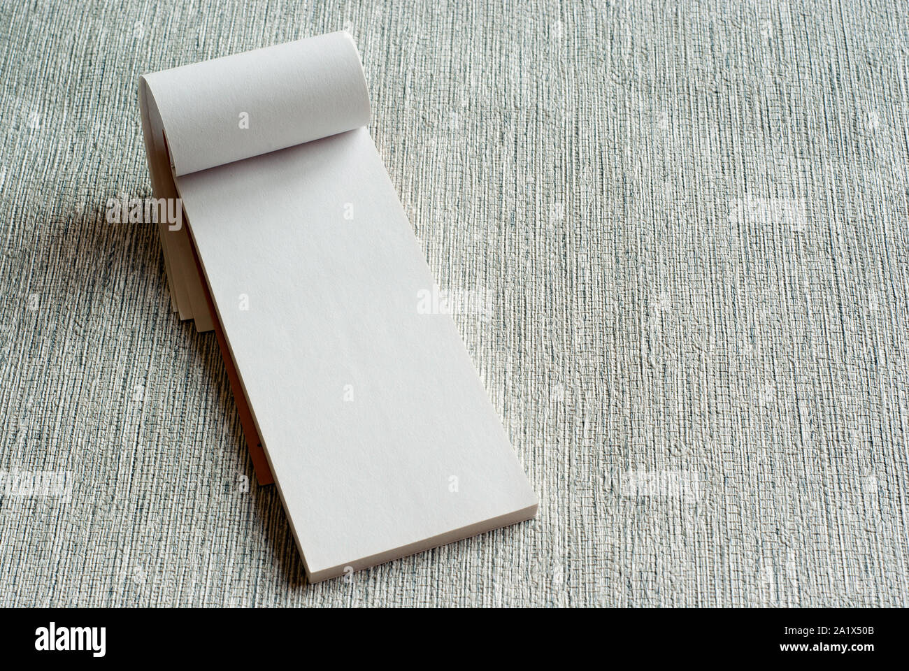 Blank white paper page of writing pad on grey background Stock Photo ...
