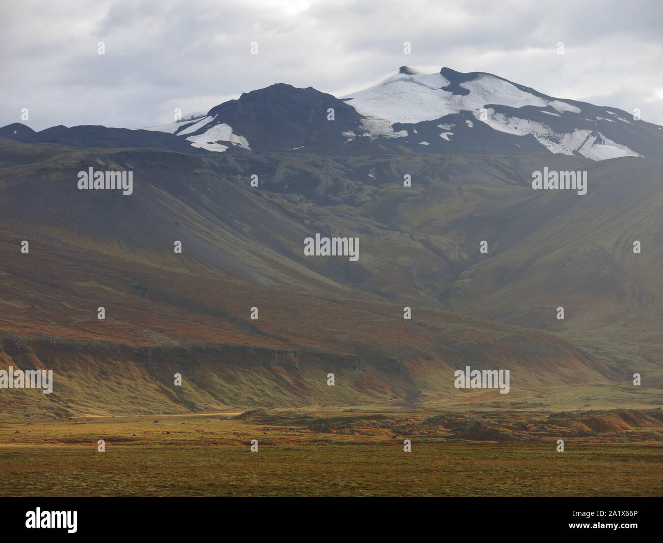 The high icecap tops the dormant volcano Snaefellsjokull, the setting ...