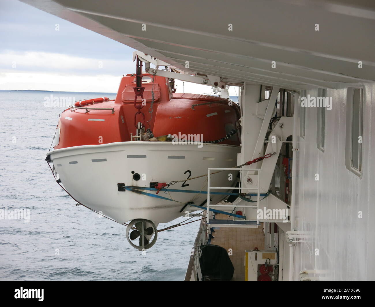 Close-up of Lifeboat Number 2 suspended from the deck on board the ...